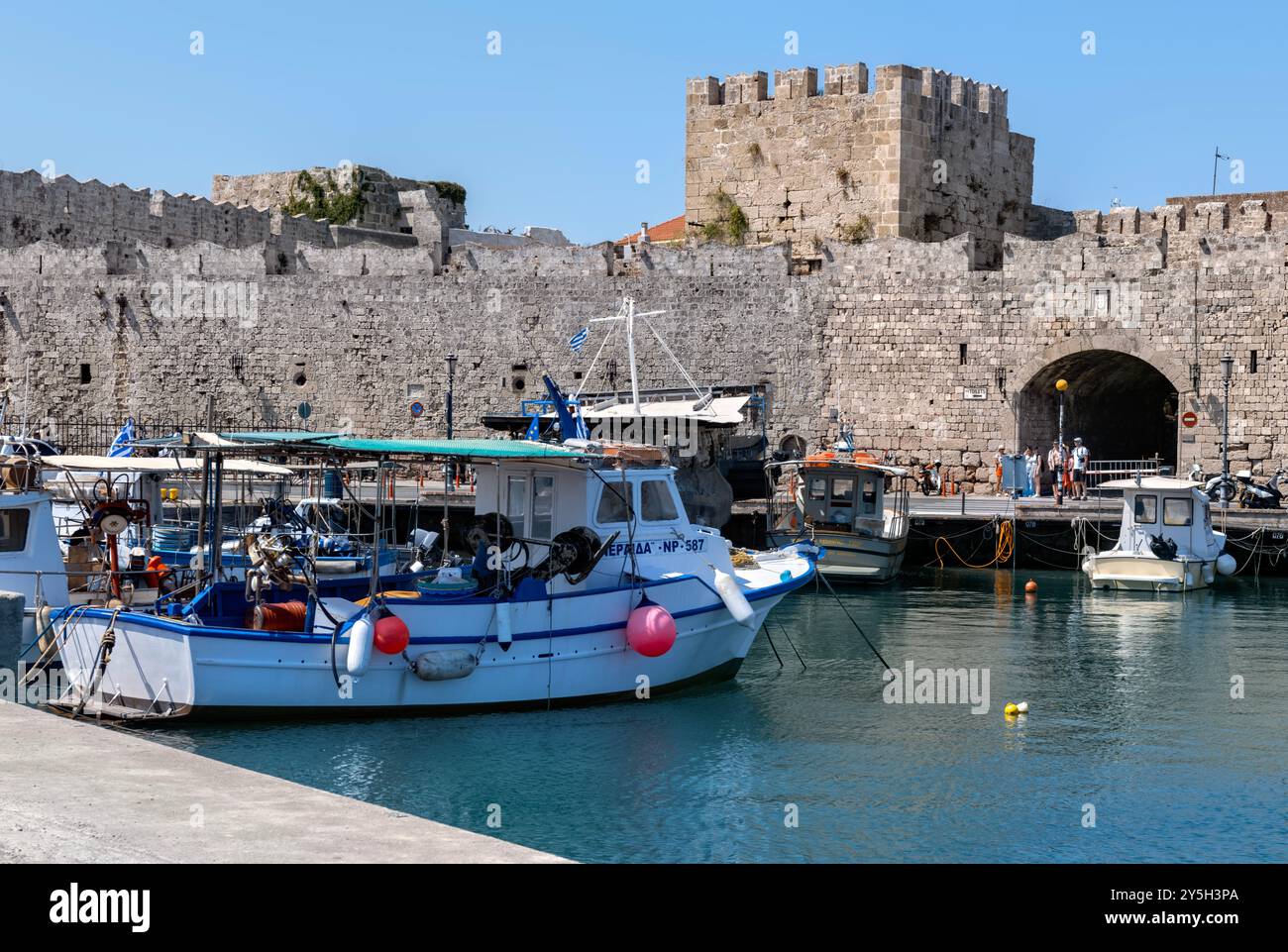 Fishing boats at Kolona Harbour and City Walls, Rhodes, Greece Stock ...