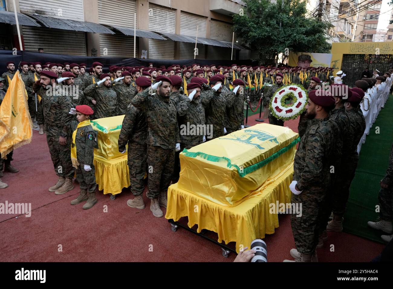 Hezbollah members salute during the funeral of Hezbollah commander ...
