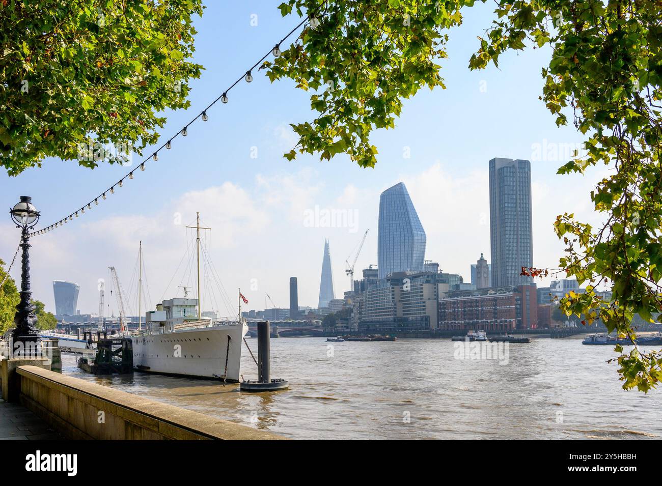 London, UK. HMS Wellington (museum and events venue) moored by the ...