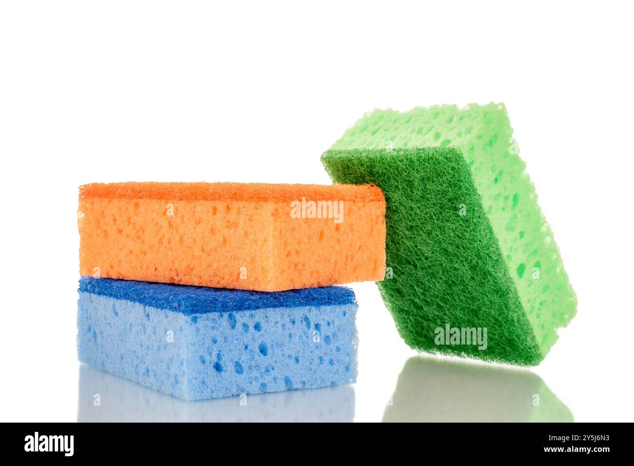Three kitchen sponges, macro, isolated on white background Stock Photo ...