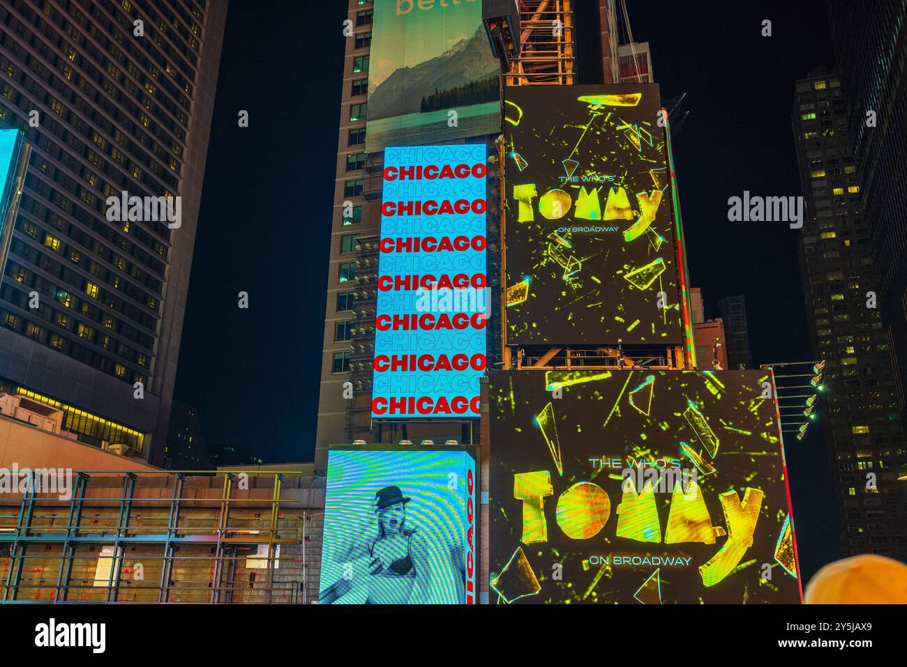 Broadway billboards at night in Times Square featuring advertisements ...