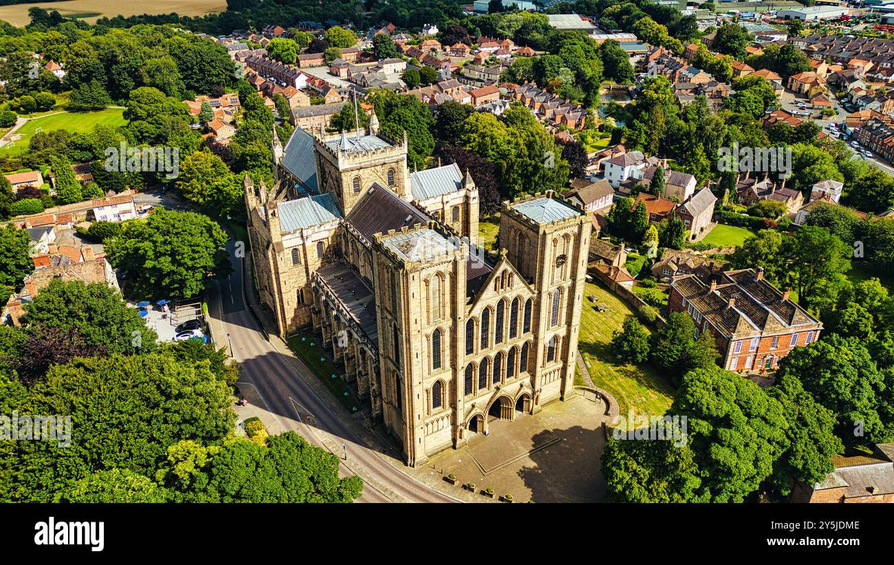 Aerial view of a large, historic cathedral surrounded by lush greenery ...