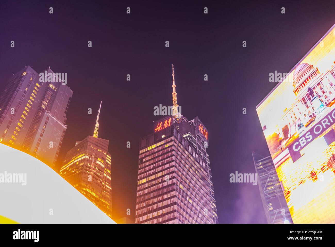 Nighttime view of skyscrapers, including the HM building, with bright ...