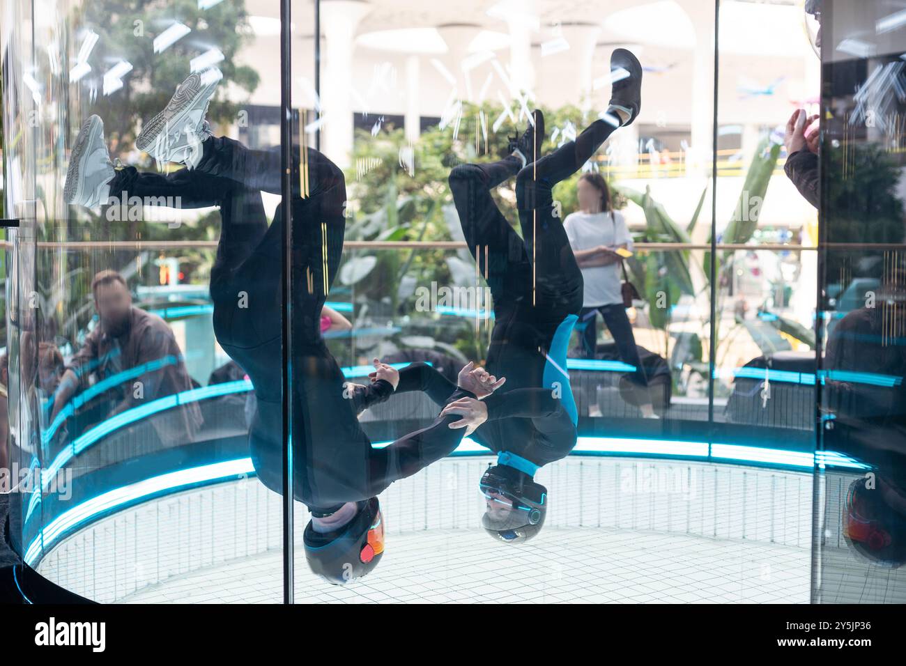 Indoor. Man fly in wind tunnel. Indoor skydiving. New fly sport Stock ...