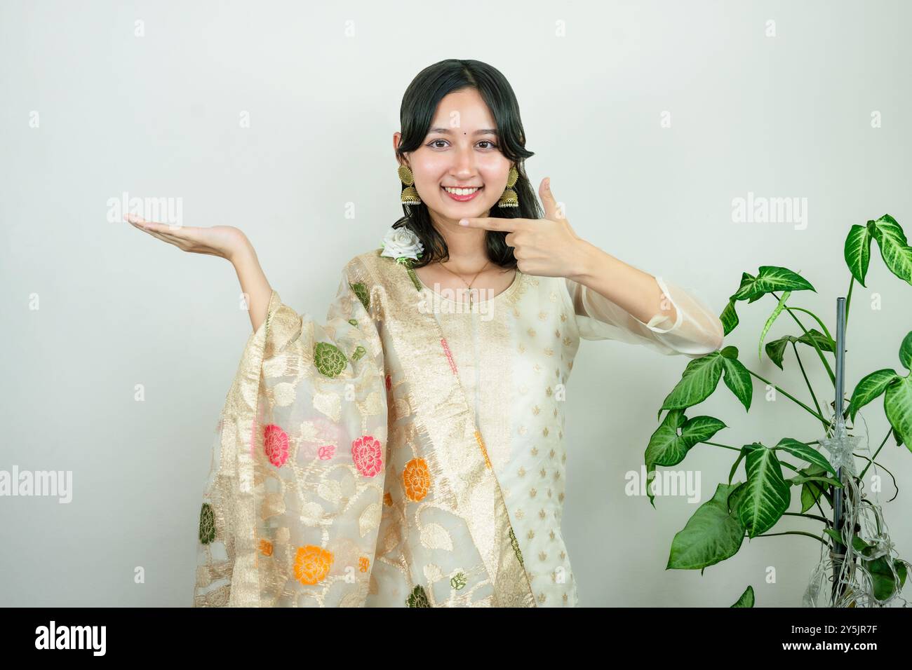 Beautiful Asian Female in Kurtha for Diwali giving Expressions ...
