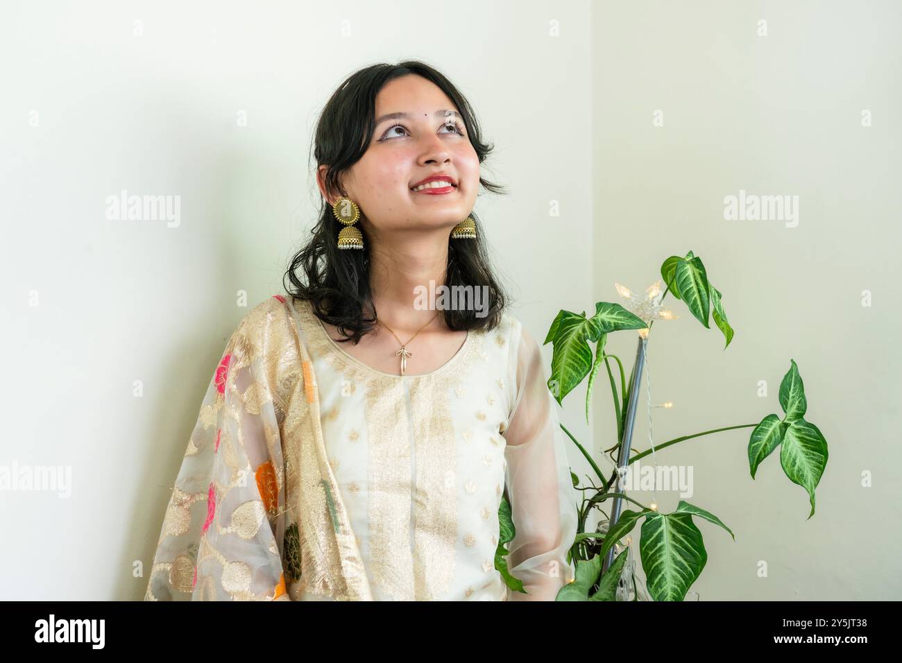 Beautiful Asian Female in Kurtha for Diwali giving Expressions ...