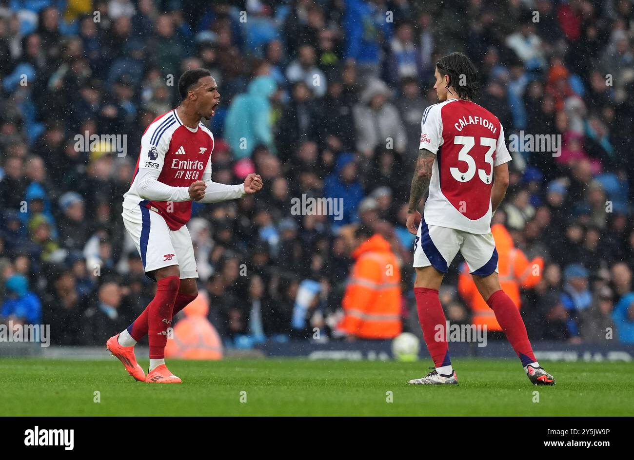 Arsenal's Gabriel (left) celebrates scoring their side's second goal of ...