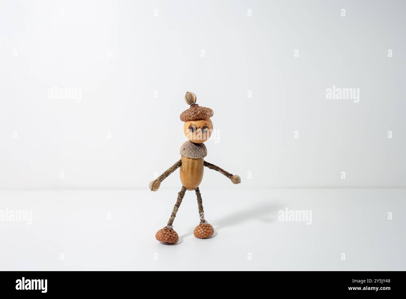 cute small figure made from acorns and sticks, autumn craft for kids ...