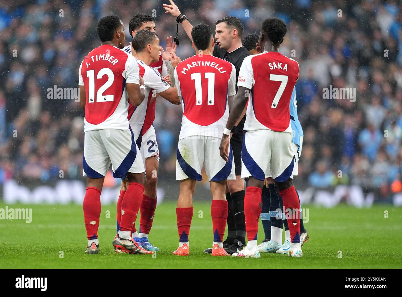 Arsenal's Leandro Trossard shown a red card by referee Michael Oliver ...