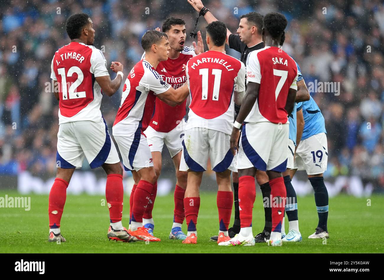 Arsenal's Leandro Trossard shown a red card by referee Michael Oliver ...