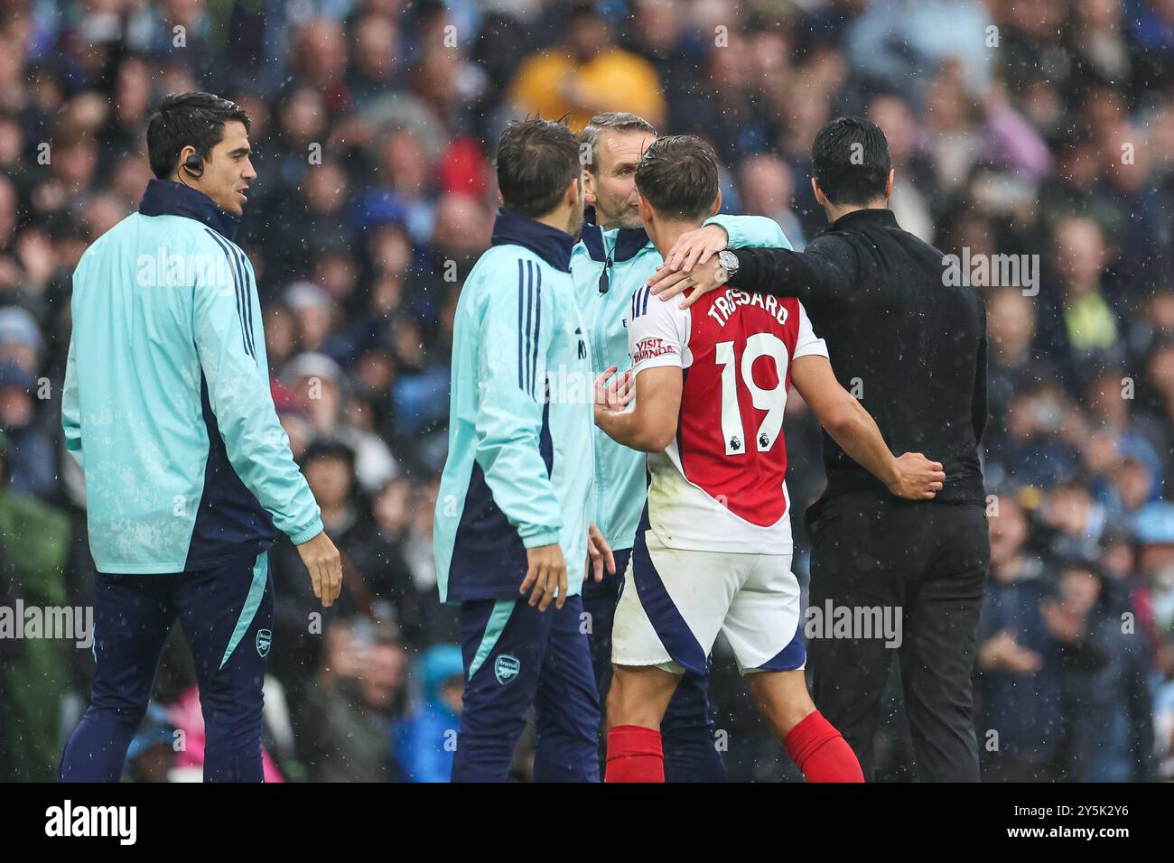 Leandro Trossard of Arsenal is consoled by Mikel Arteta manager of Arsenal after being sent of ...