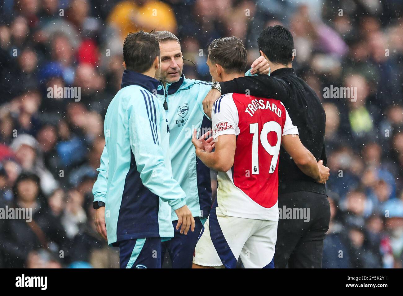 Leandro Trossard of Arsenal is consoled by Mikel Arteta manager of ...