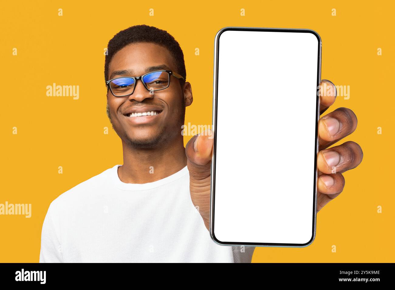 African american guy showing thumb up and smiling Stock Photo - Alamy