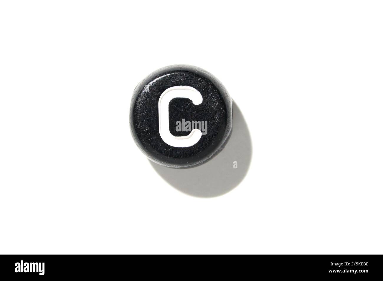 Close-up of a black keyboard key with white c symbol isolated on a ...