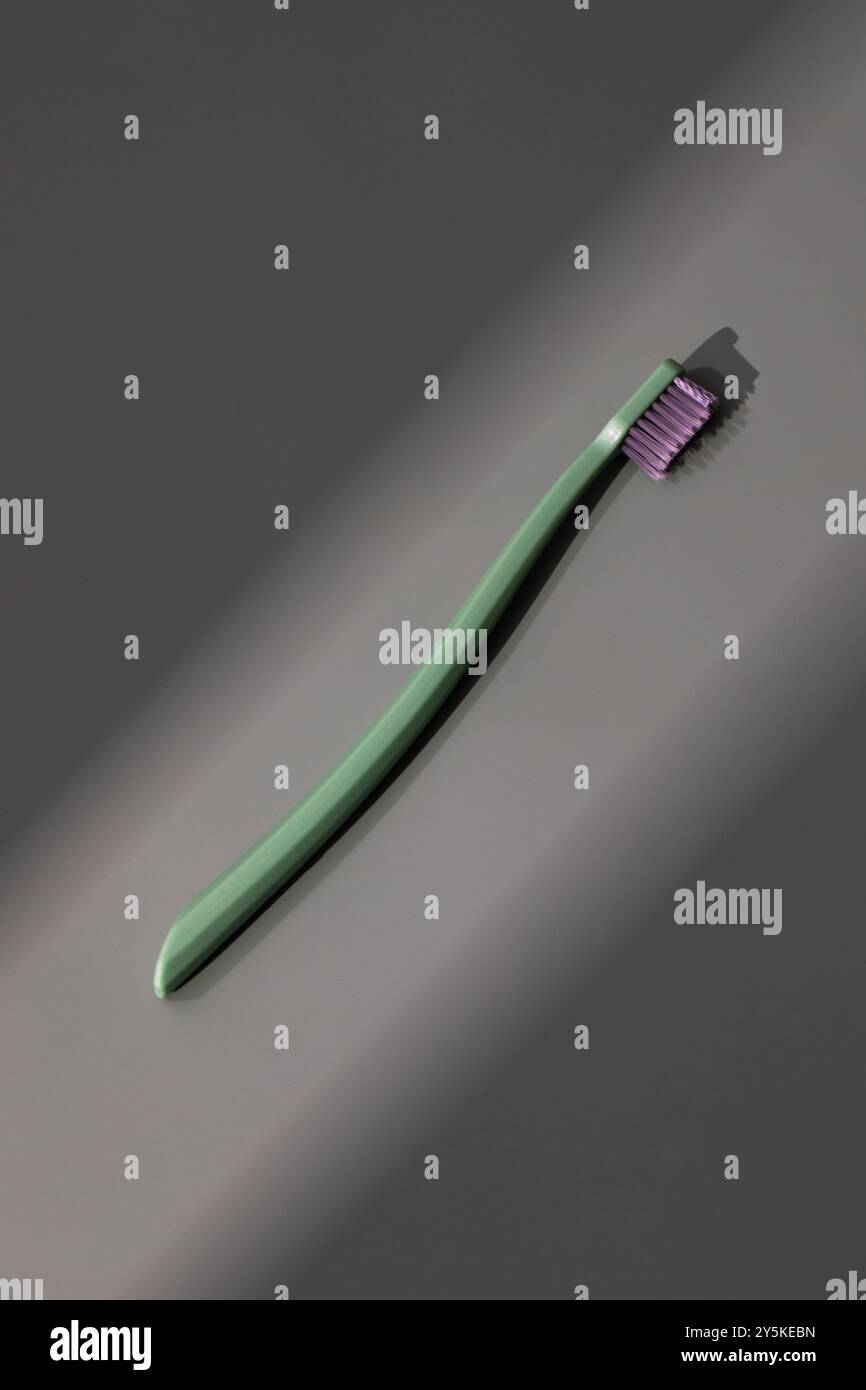 Plastic toothbrush with soft bristle lit by diagonal beam Stock Photo ...