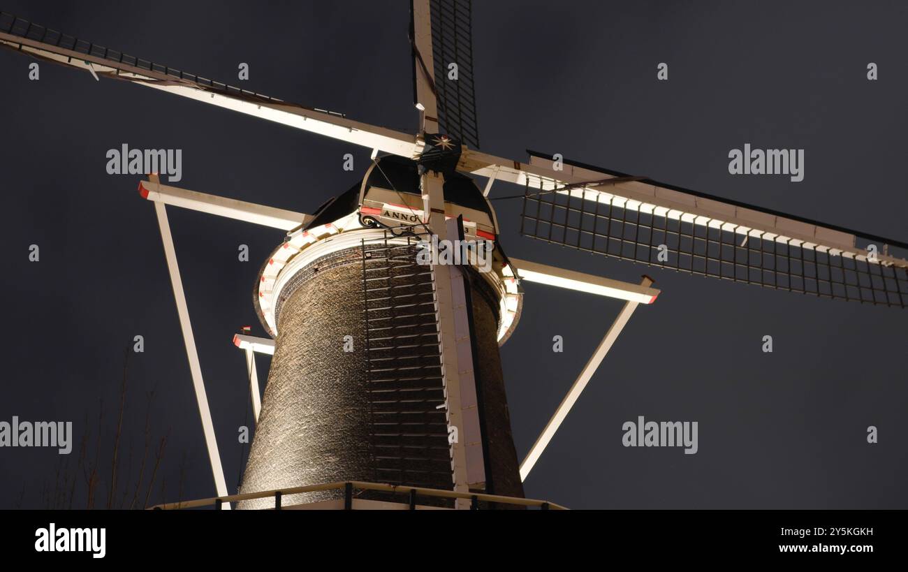 The Illuminated Molen De Valk windmill at night with a dark sky ...