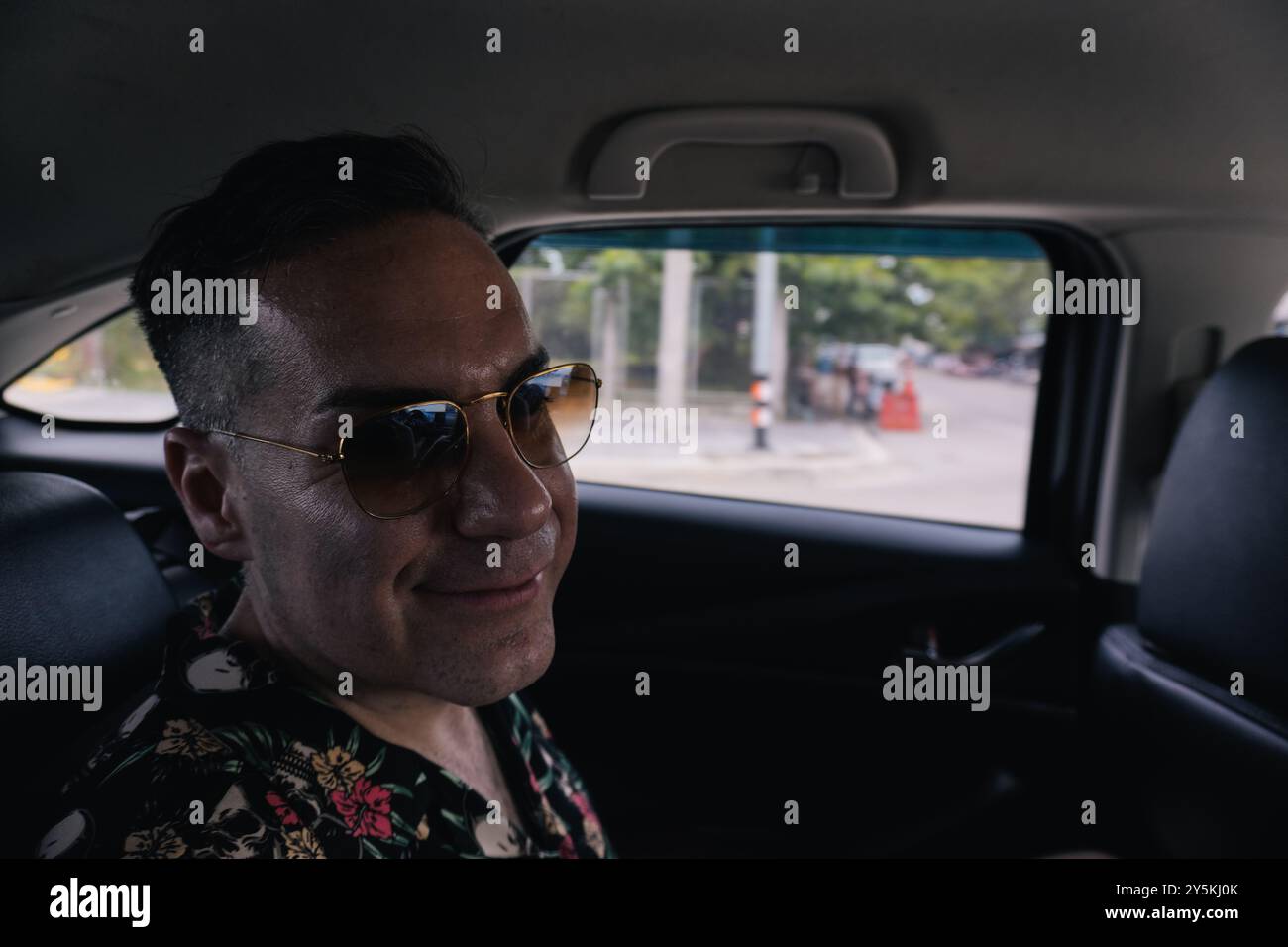 Smiley mid adult tourist in a taxi in Thailand Stock Photo - Alamy