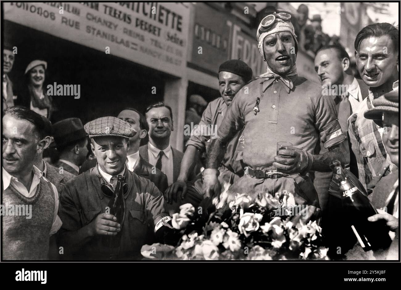 Tazio Nuvolari celebrating his victory at the 1932 French Grand Prix ...