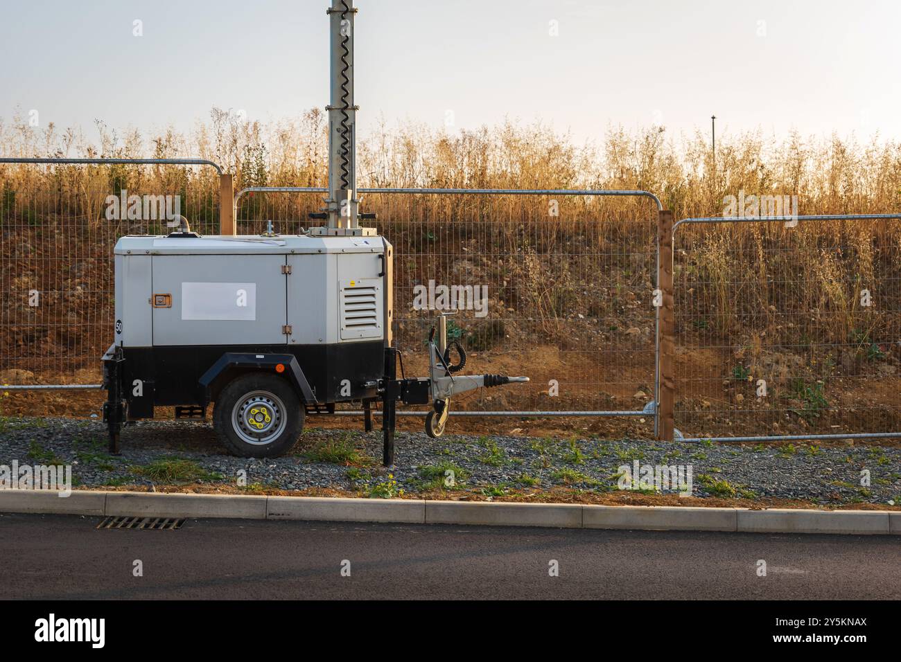 Mobile construction lights next to new housing development in england ...