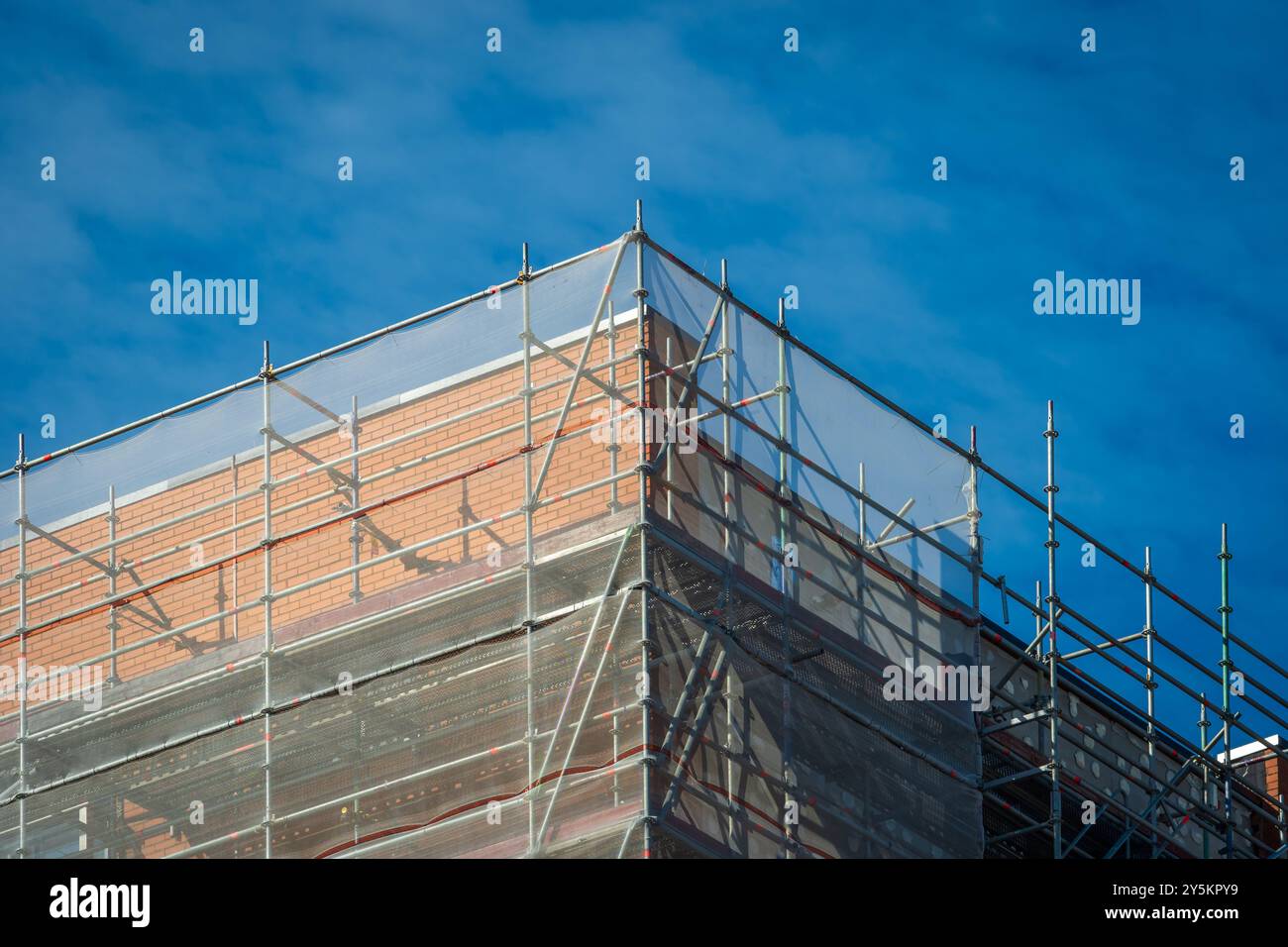 Scaffold sheeting net wrapped apartments building during insulation in ...