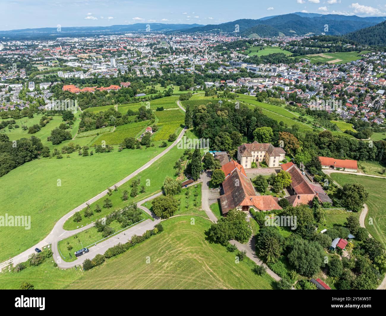 Aerial view of castle Jesuitenschloss Merzhausen and city Freiburg ...