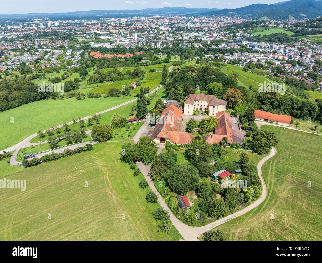 Aerial view of castle Jesuitenschloss Merzhausen and city Freiburg ...