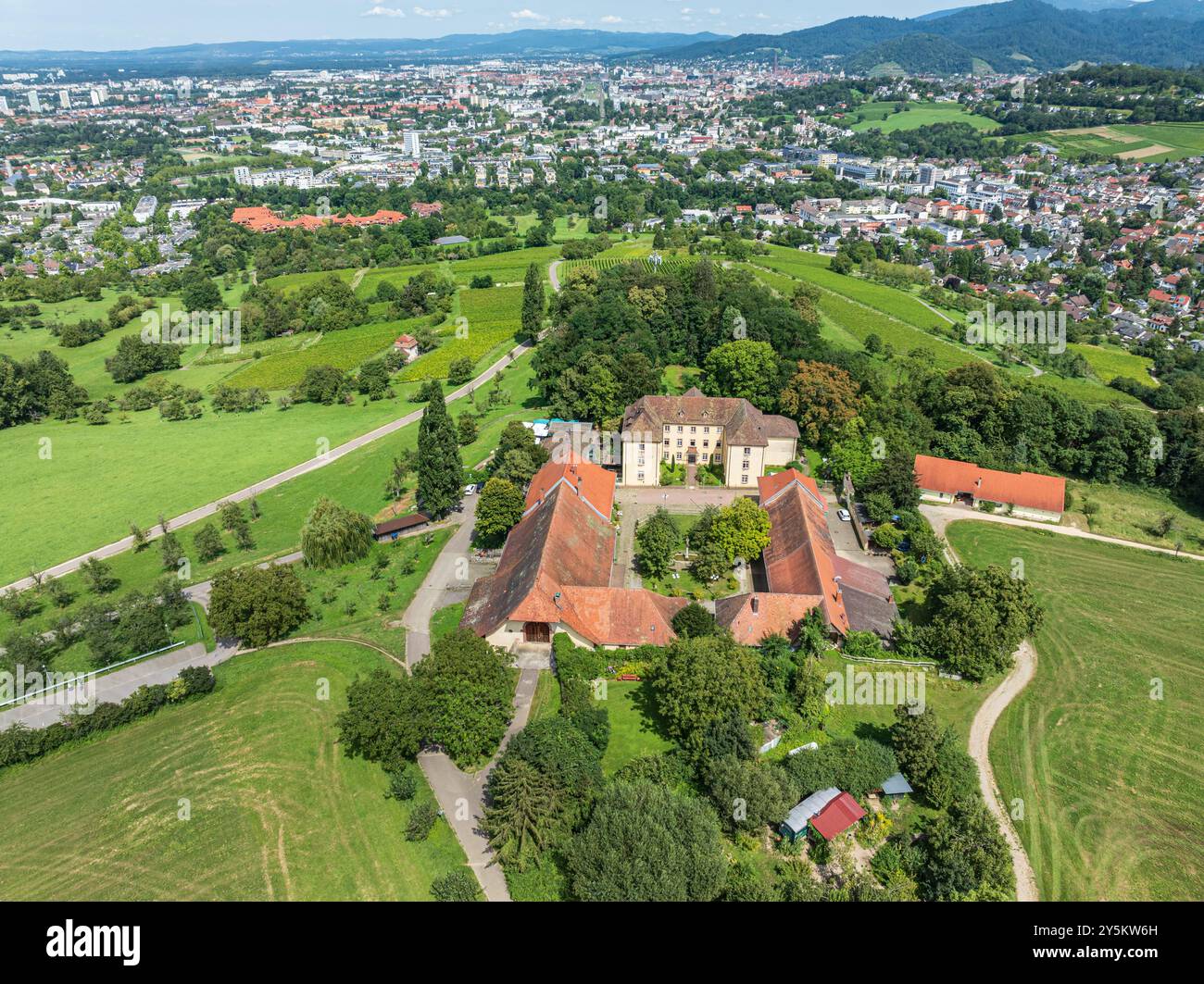 Aerial view of castle Jesuitenschloss Merzhausen and city Freiburg ...
