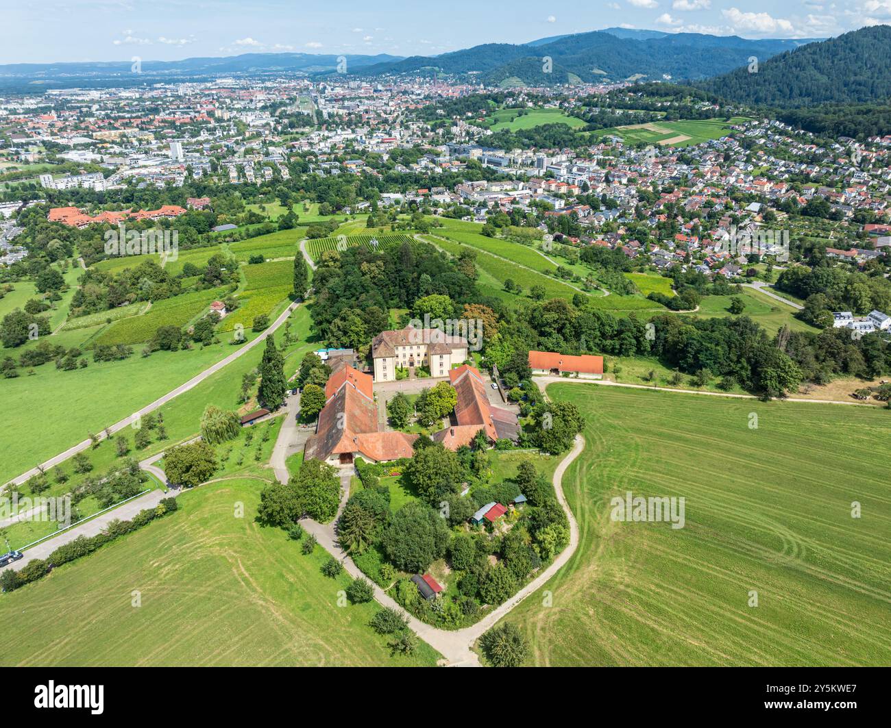 Aerial view of castle Jesuitenschloss Merzhausen and city Freiburg ...