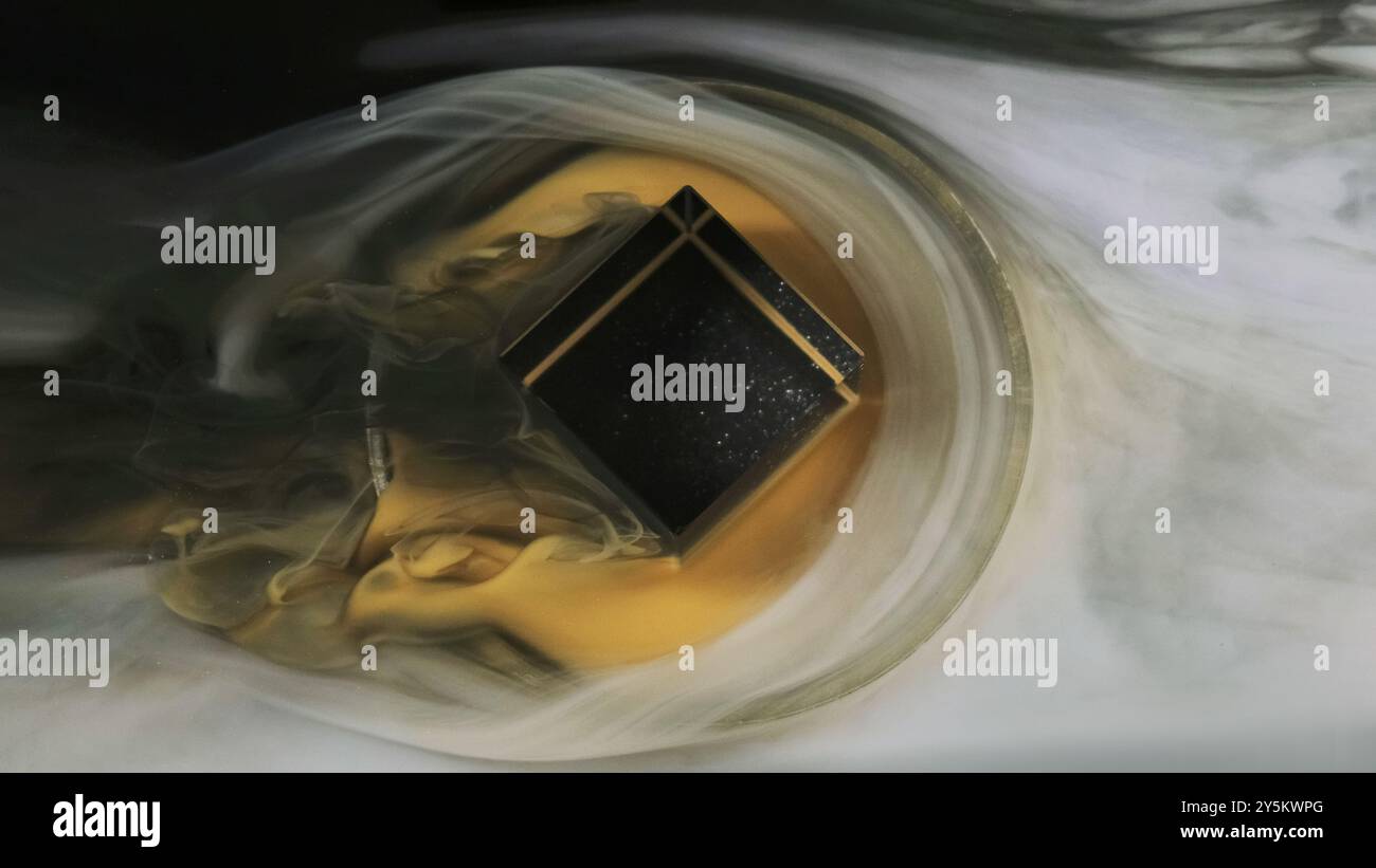 Ink steam. Color water. White paint flow black yellow dye blend cosmic ...