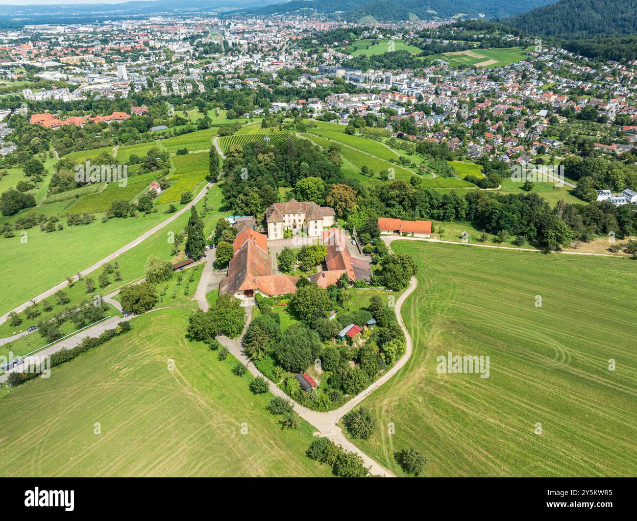 Aerial view of castle Jesuitenschloss Merzhausen and city Freiburg ...