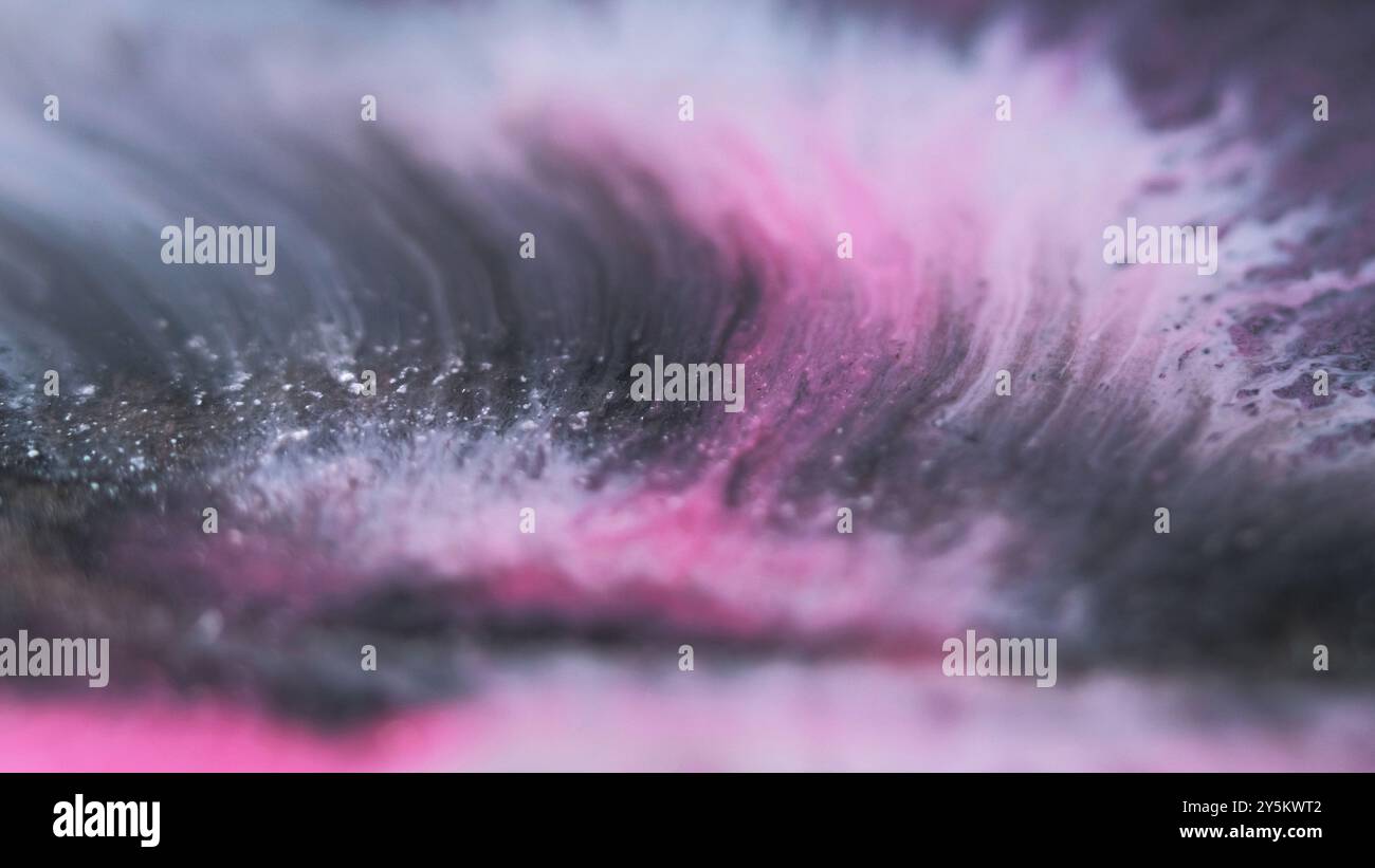 Paint splash. Wet blotch. Defocused pink black white color shiny grain ...