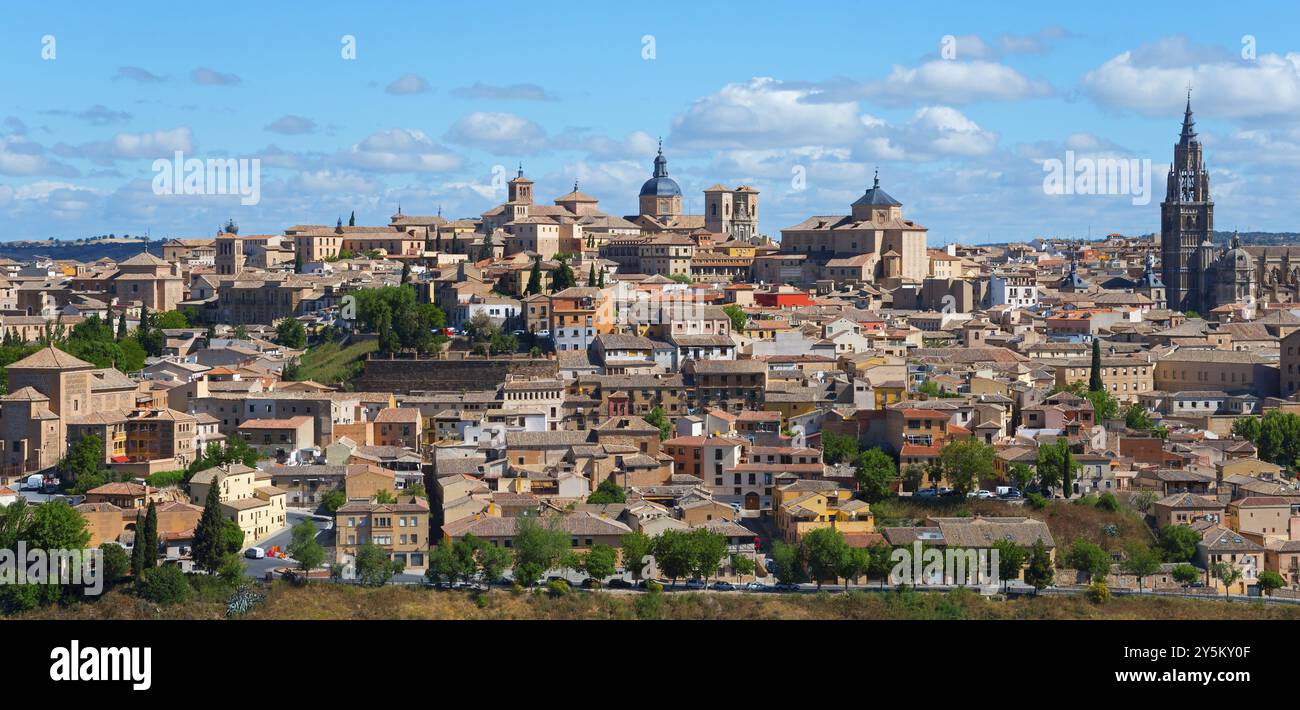 Panorama of Toledo with historical buildings and a cathedral under a ...