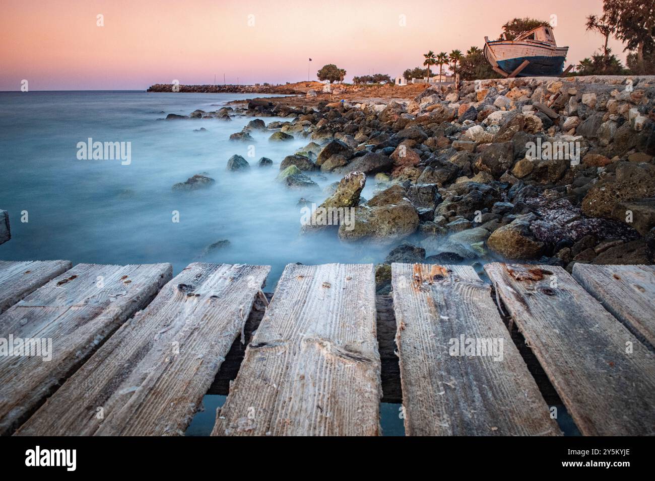 A long exposure photograph of a dilapidated jetty in Crete, Greece ...