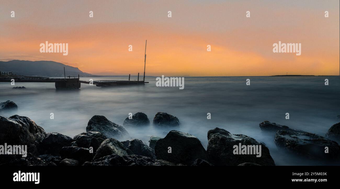 A long exposure photograph of a dilapidated jetty in Crete, Greece ...