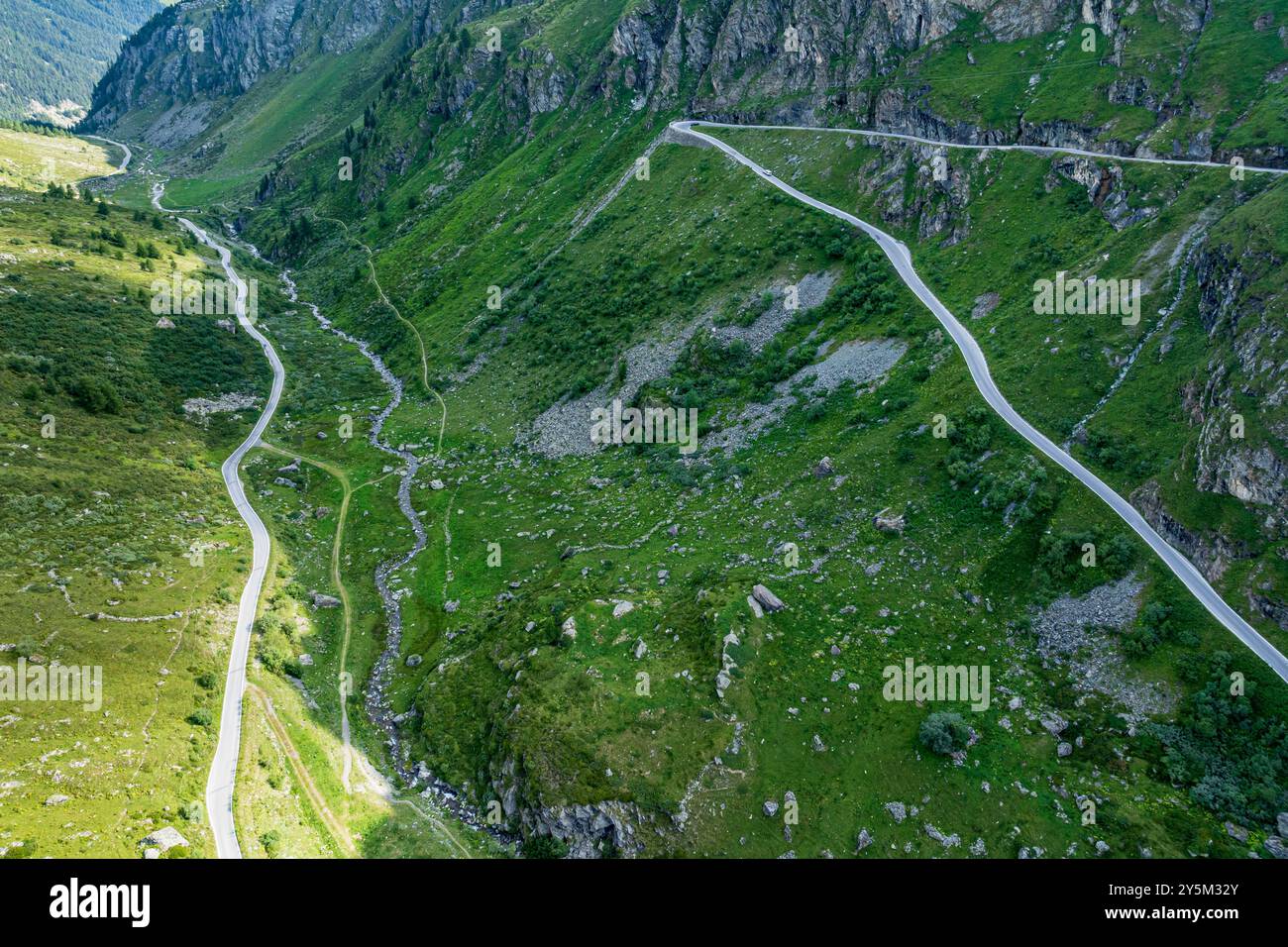 Mountain road up to Lac de Moiry, mountain lake and dam, final curves ...