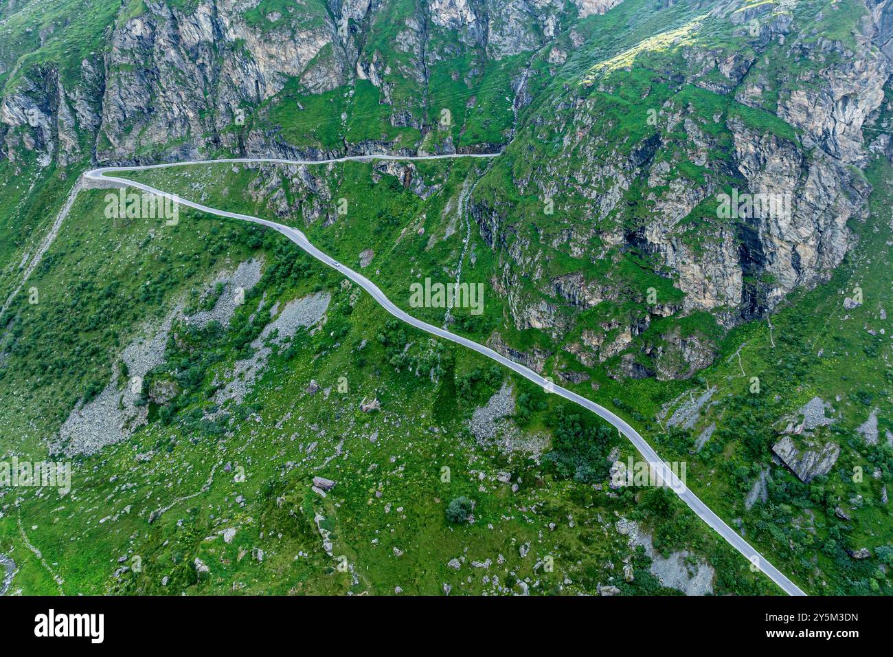 Mountain road up to Lac de Moiry, mountain lake and dam, final curves ...