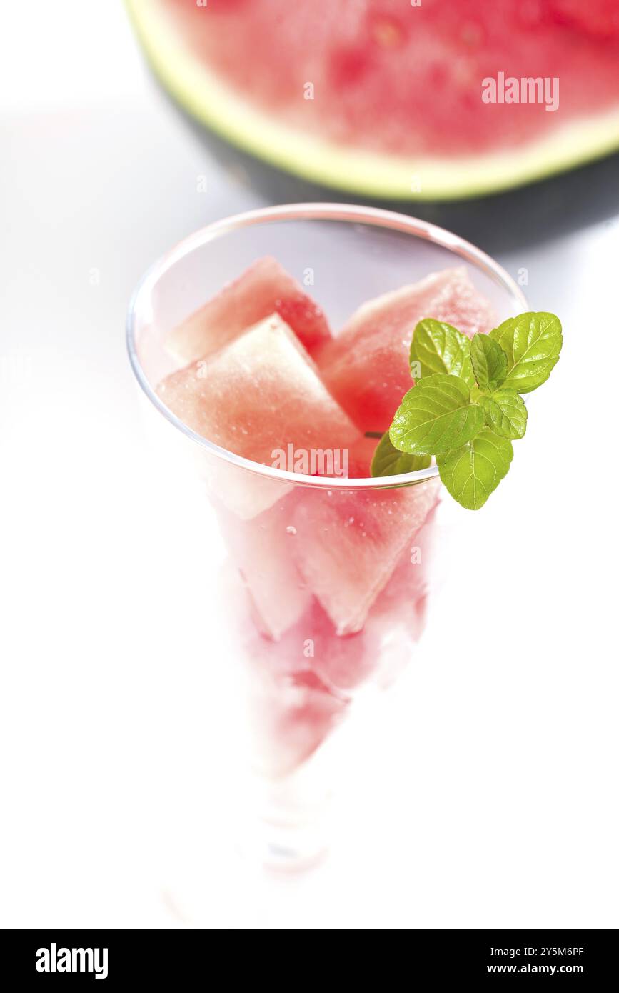Diced melon, watermelon on a light-coloured background Stock Photo - Alamy