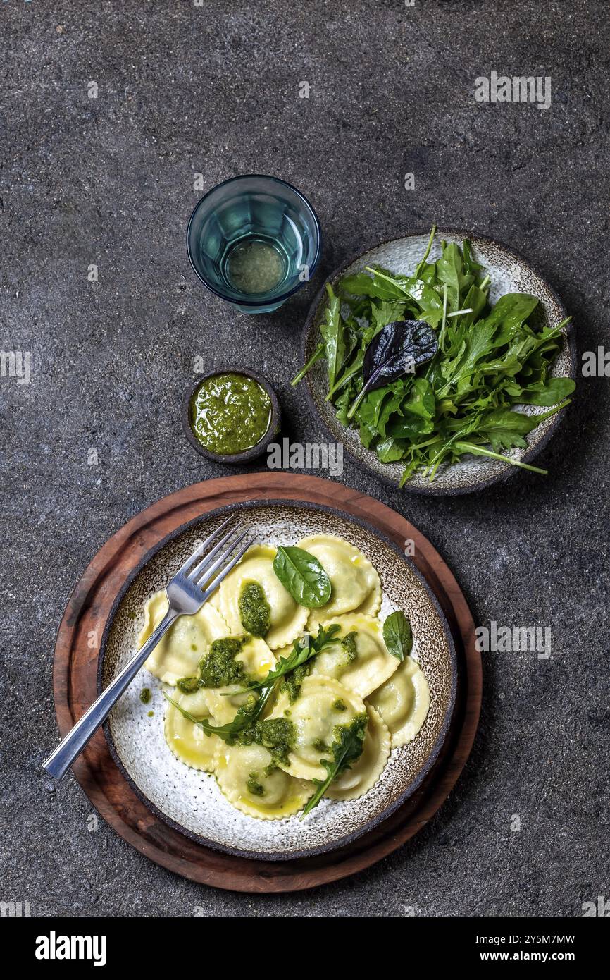 Italian spinach ricotta ravioli, Top view, black background, copy space ...