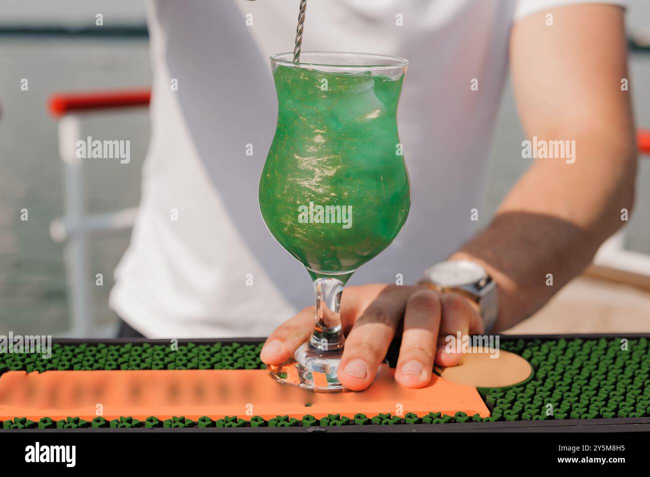 Refreshing Green Cocktail with Sparkling Garnish Served on a Stylish ...