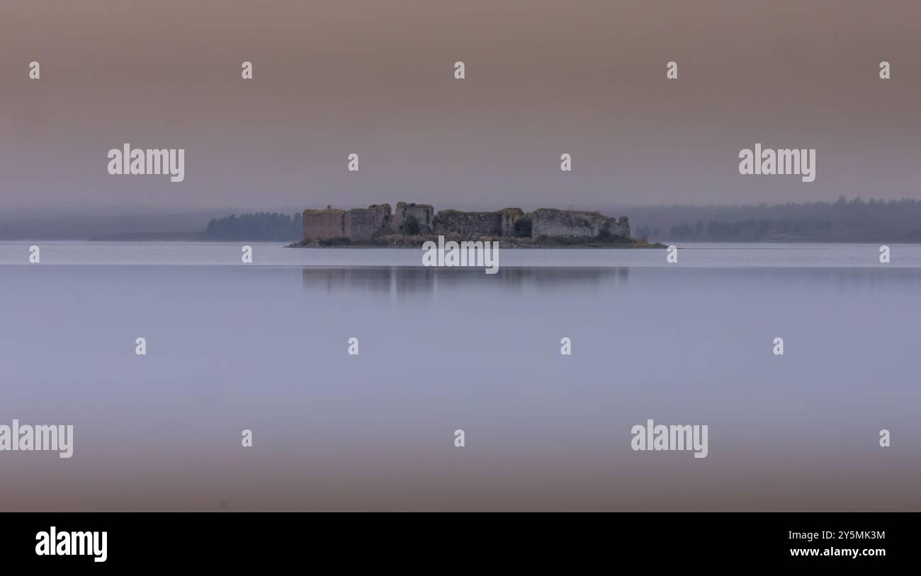 Lochindorb castle on a very misty and still early morning Stock Photo ...