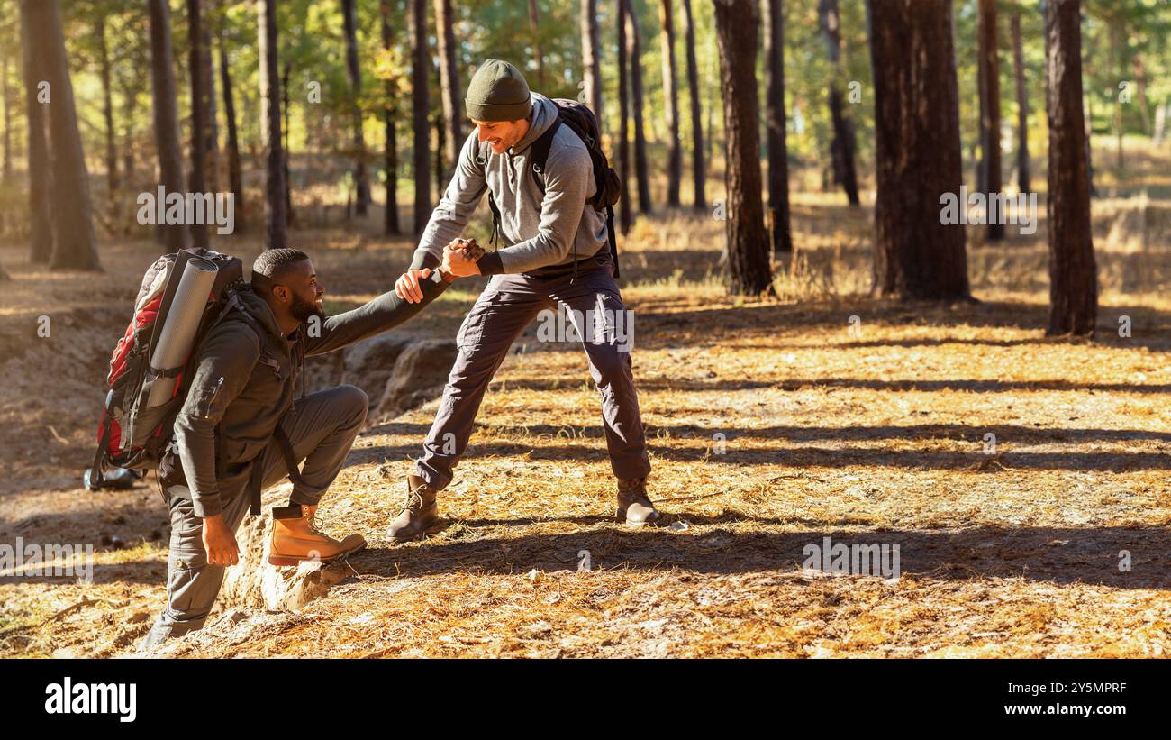 One man helping another man hi-res stock photography and images - Alamy