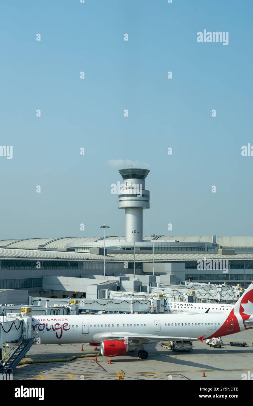 An Air Canada rouge plane parked at Toronto’s Pearson International ...