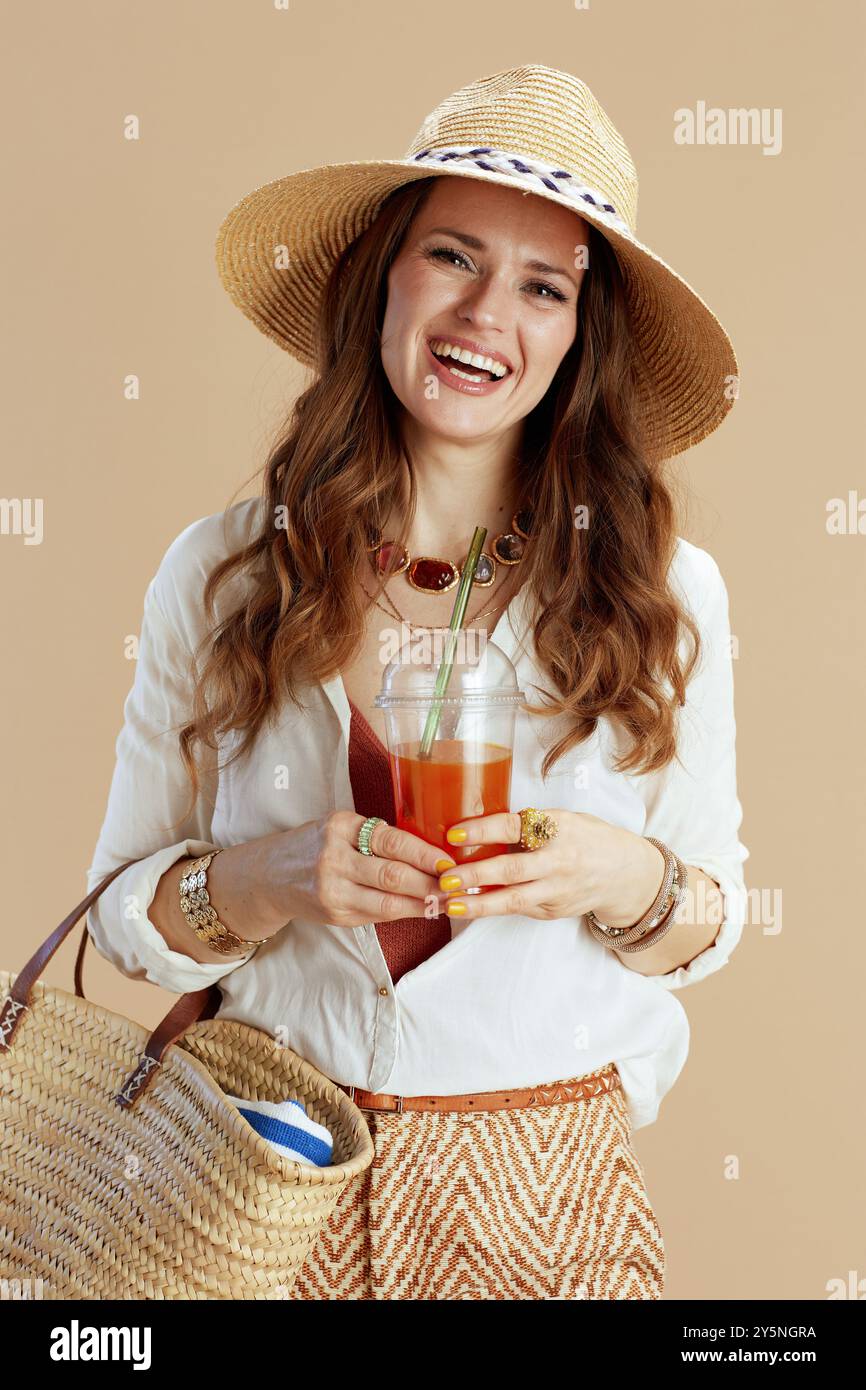 Beach vacation. happy stylish 40 years old woman in white blouse and ...