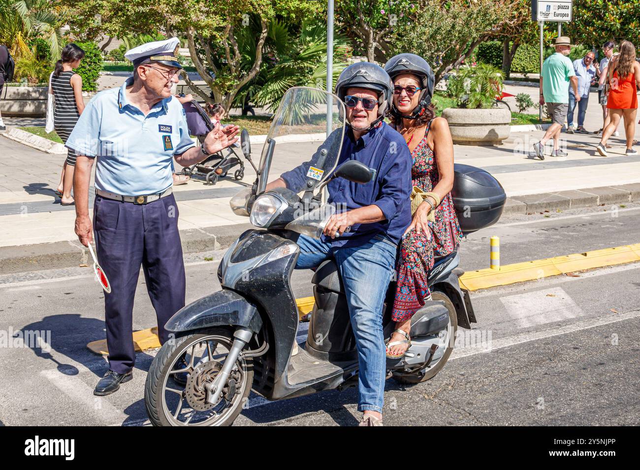 Messina Sicily Italy,man woman couple,riding motor scooter,municipal policeman police,senior ...