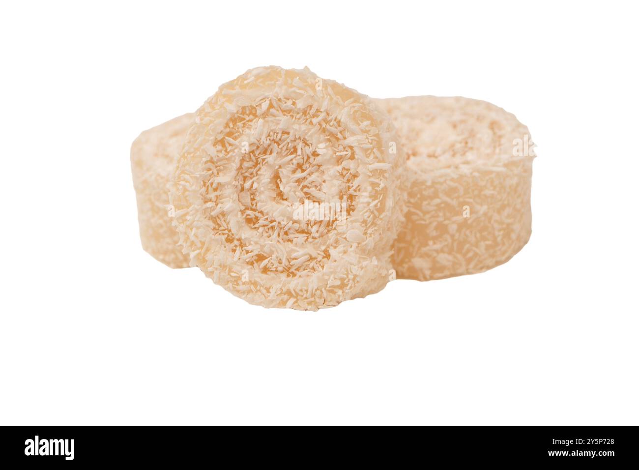 Coconut candy roll isolated on a white background Stock Photo - Alamy