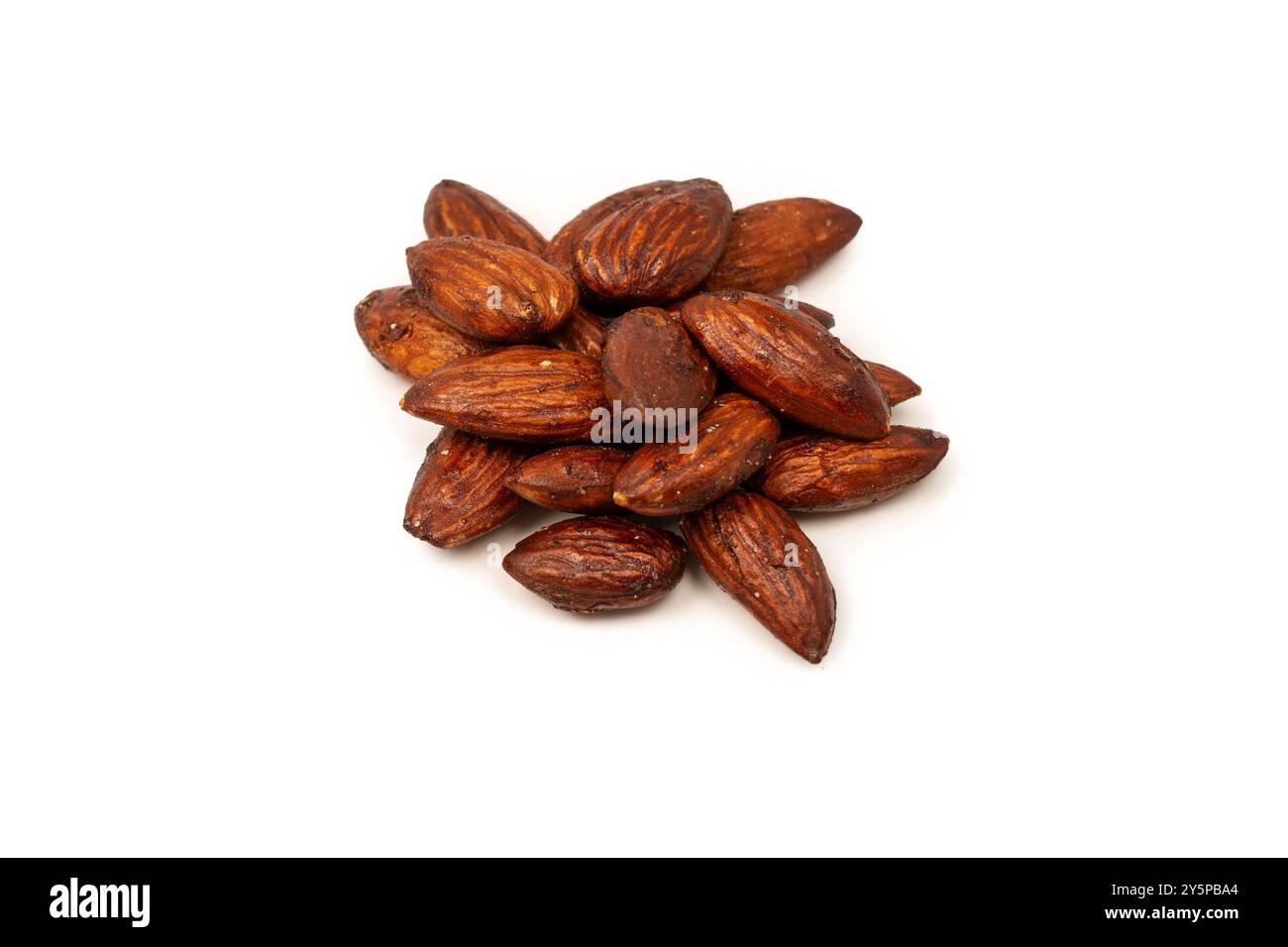 A group of caramelized almonds isolated on a white background Stock ...