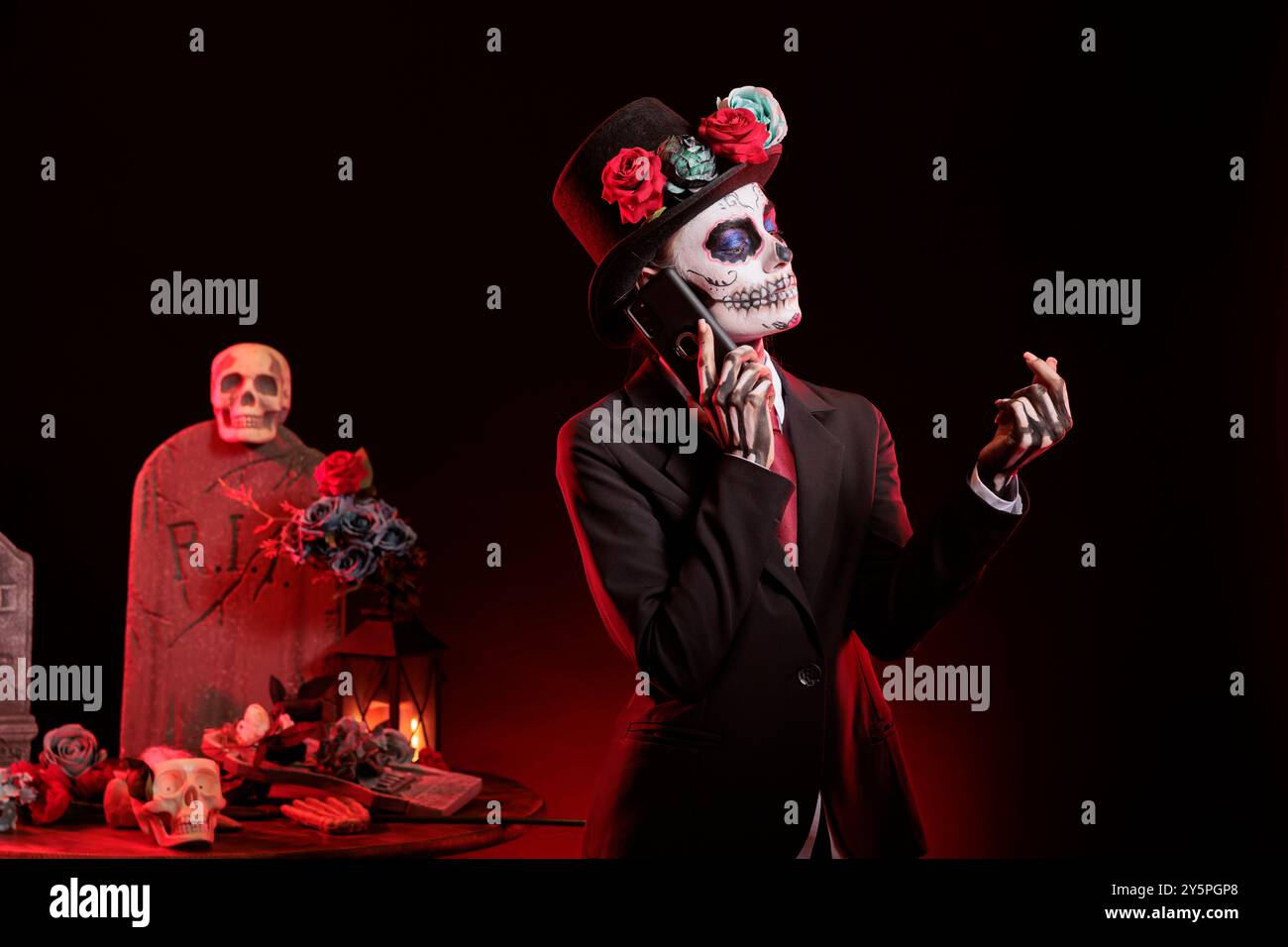 Woman doing telephone call during Dia de los Muertes indigenous rites ...
