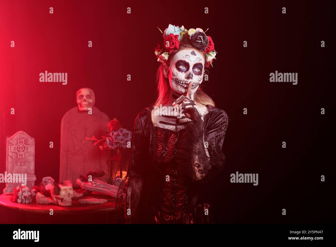 Mysterious woman doing shush finger gesture during Day of the Dead ...