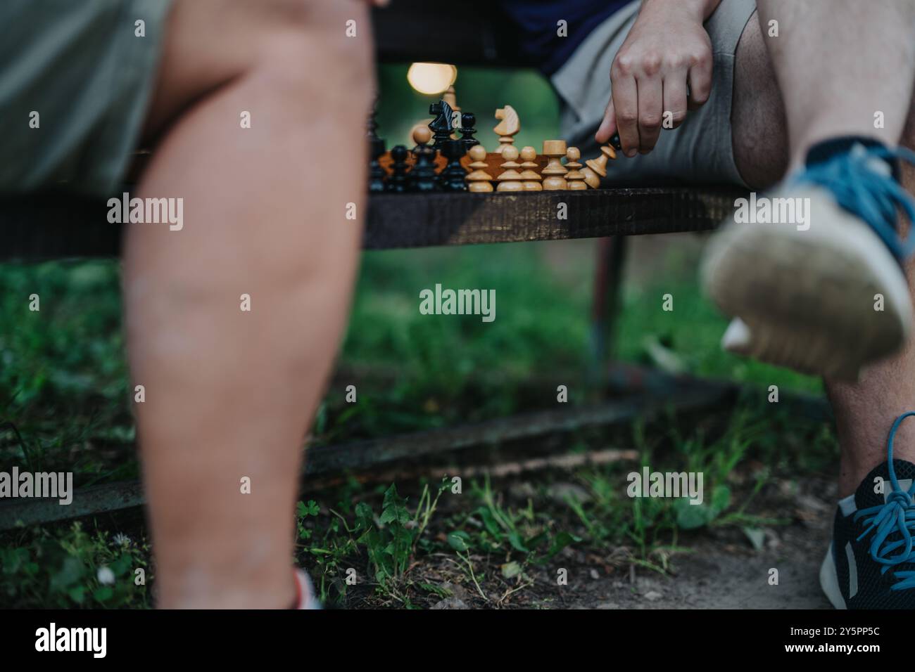Outdoor chess game between two people on a park bench Stock Photo - Alamy