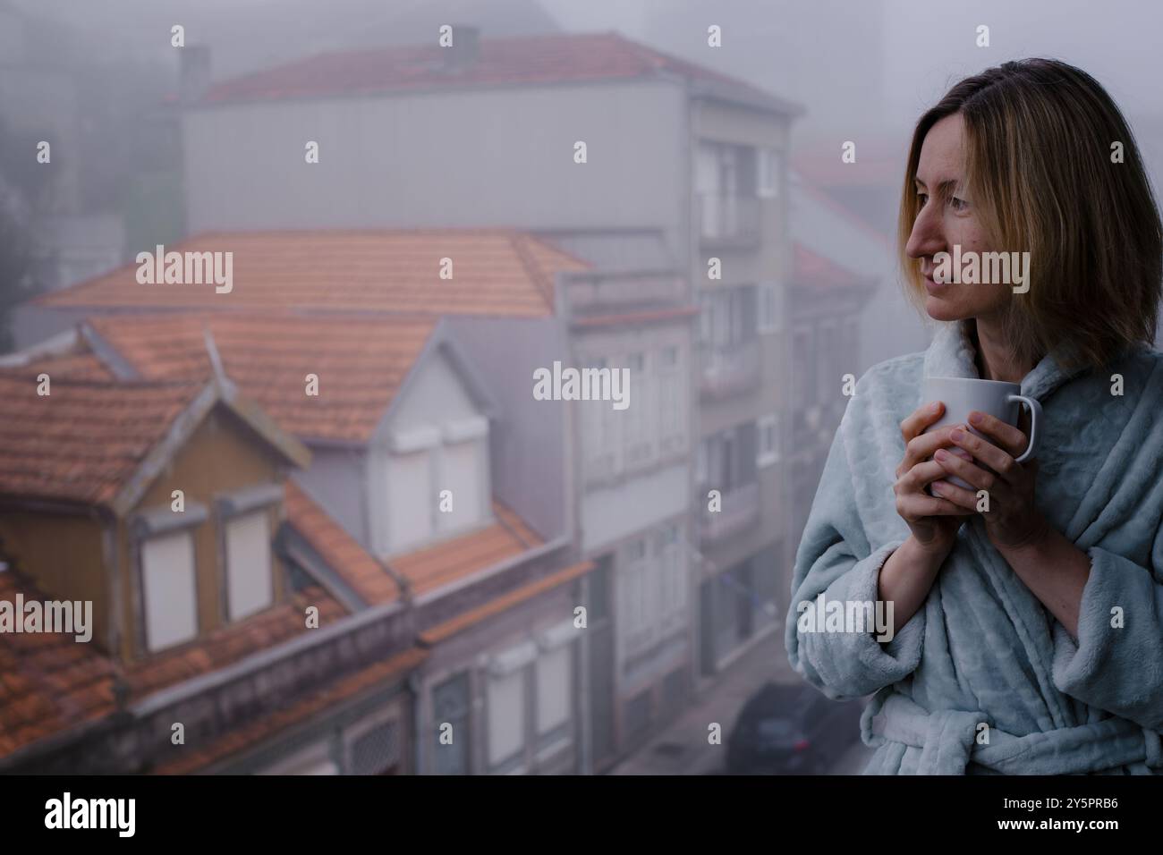 Woman balcony relaxation gazes hi-res stock photography and images - Alamy